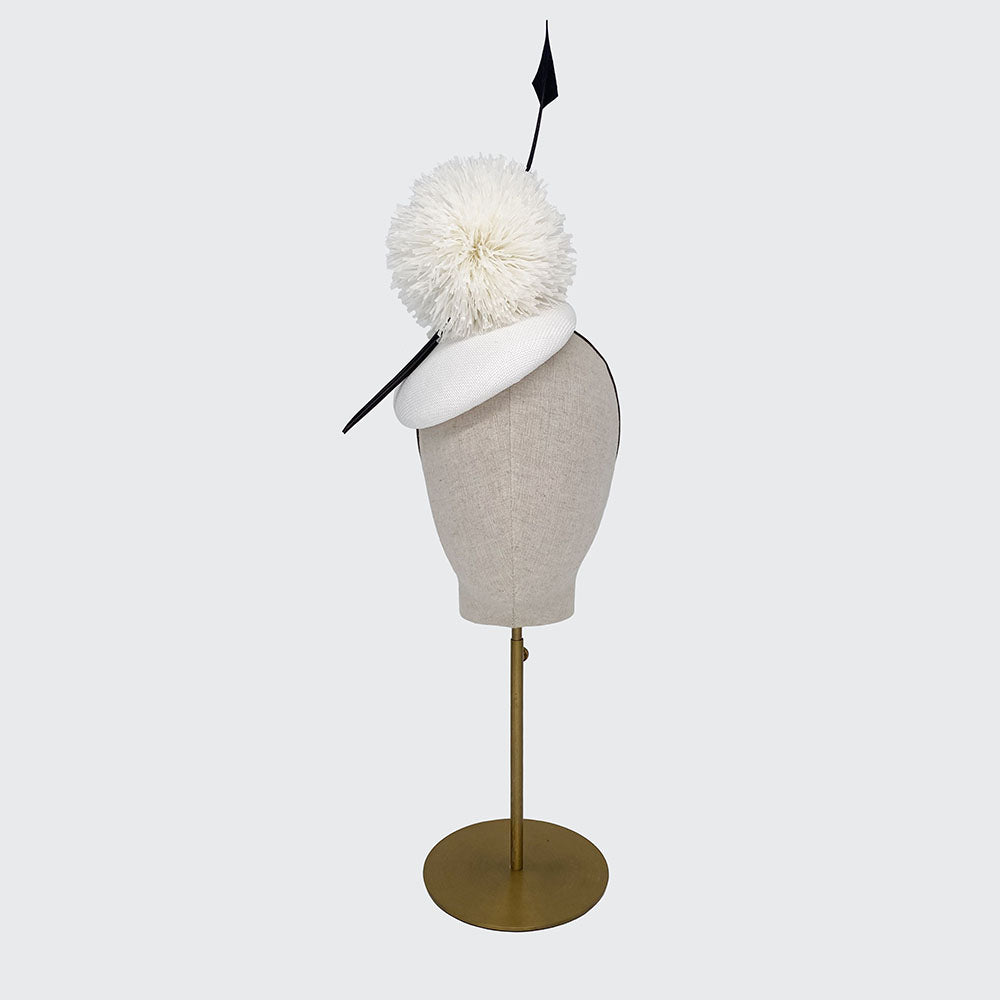 White pillbox with white raffia and black feather – Rachel Trevor-Morgan